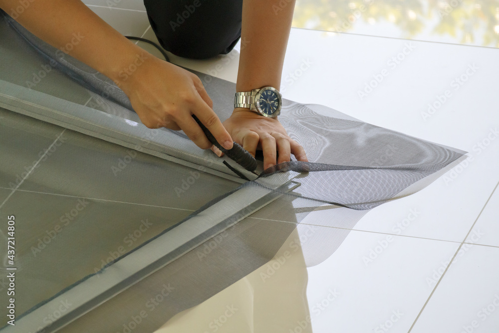 man install mosquito net wire screen on house window protection against ...