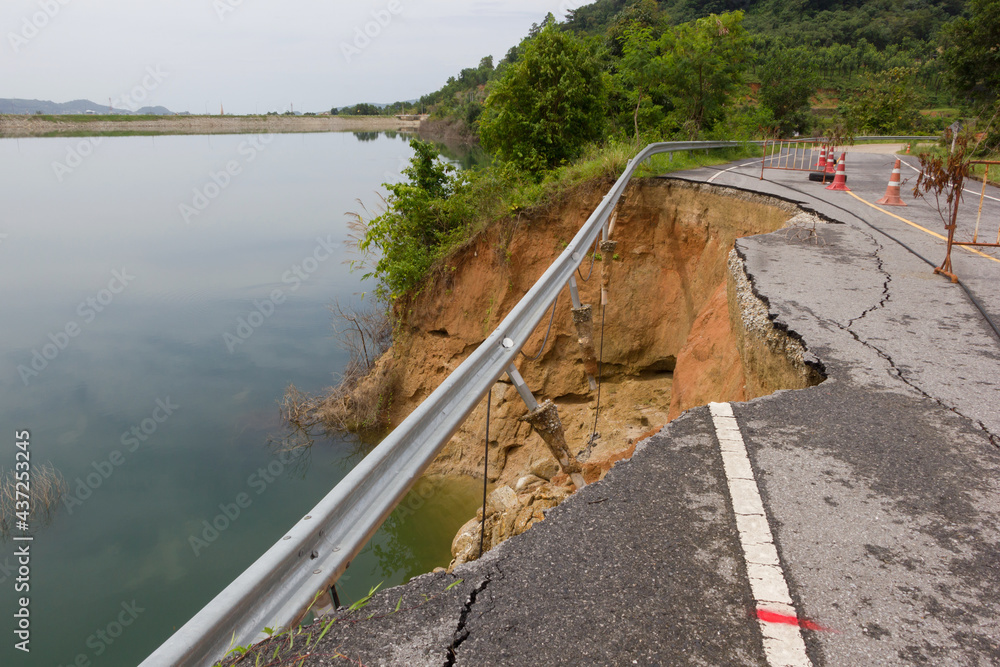 Asphalt road collapsed and cracks in the roadside, Road landslide ...