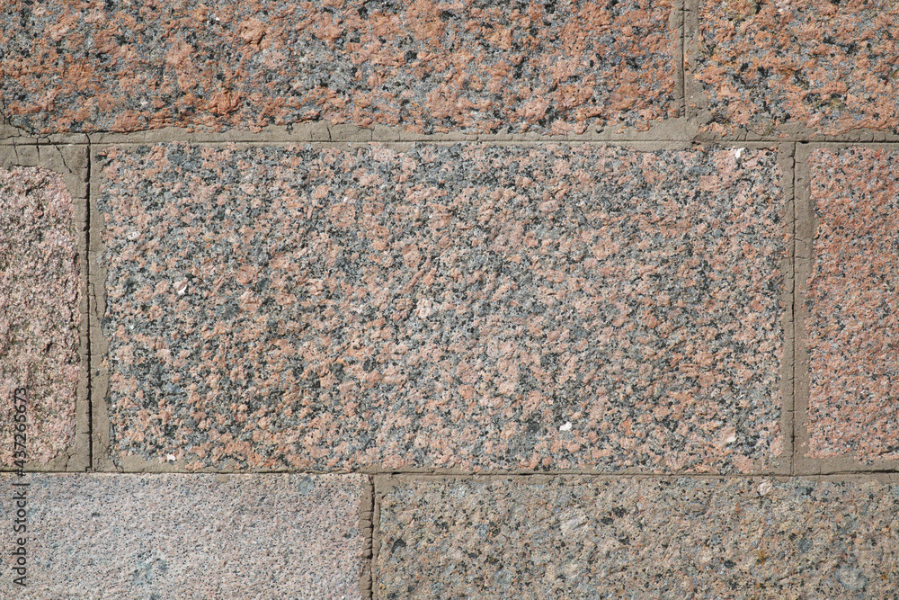The wall is made of rectangular granite blocks. Hewn granite stone ...