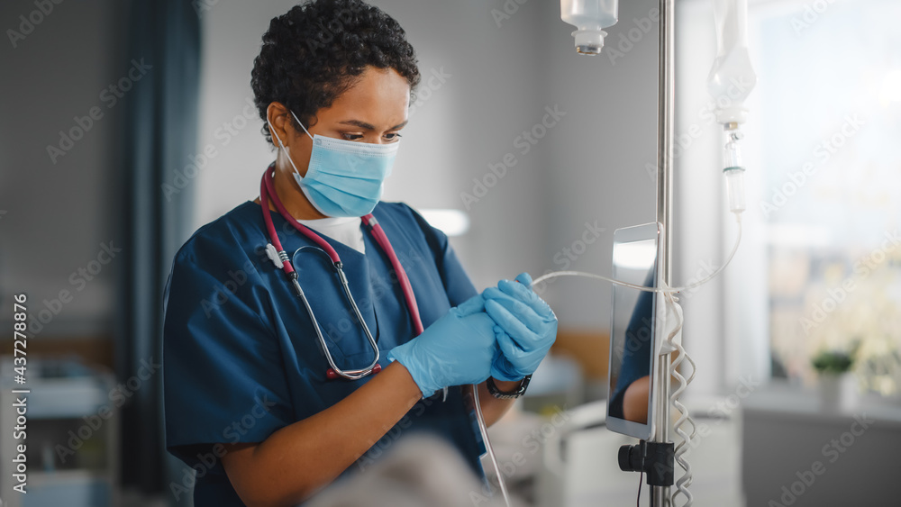 Hospital Ward: Professional Black Head Nurse Wearing Face Mask Does Checkup of Patient's Vitals ...