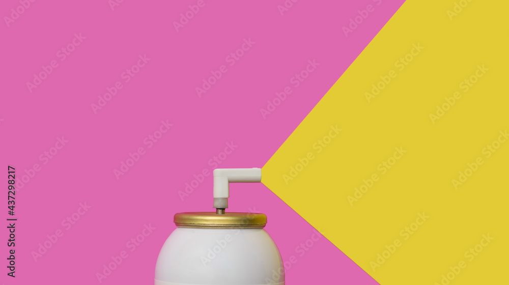 Blank white copy space spray can on a pink background spraying yellow ...