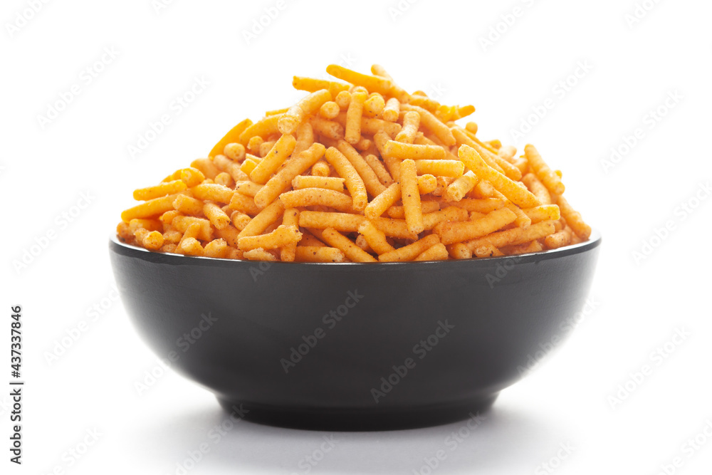Close-up of Nimbu masala besan sev Indian namkeen (snacks) in black ...