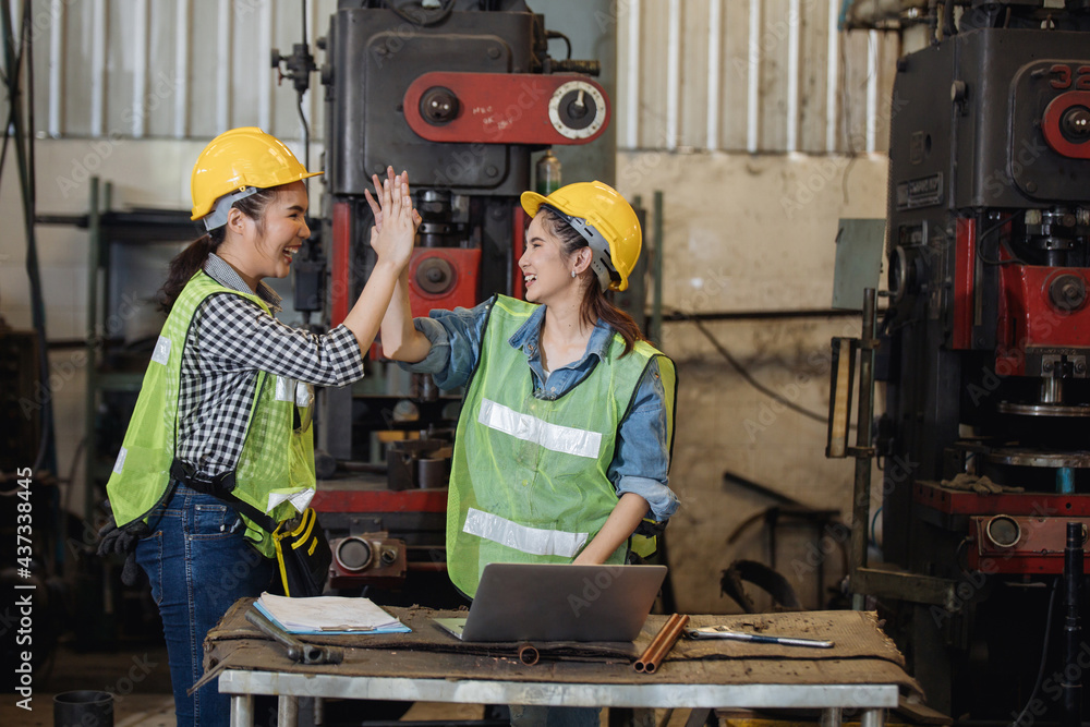 worker giving high five to his friend colleague. Workers hands touching ...