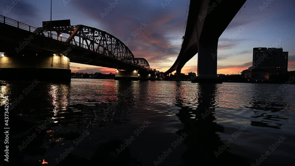 Blurred animated video background of the twilight sky on the riverside ...