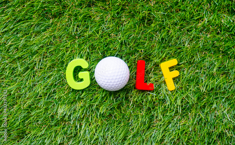 Text Golf written with golf ball and toy letters lying on the green ...