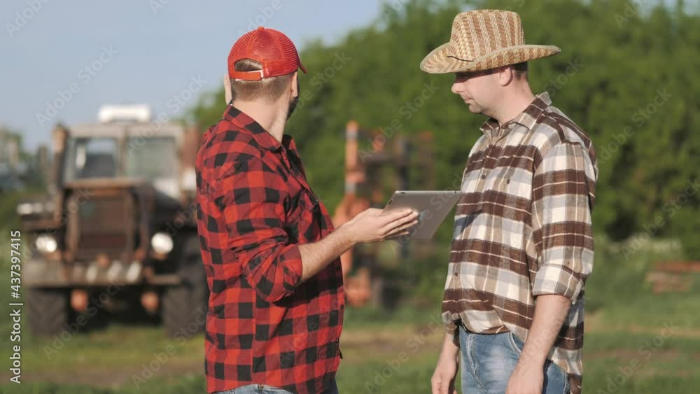 Farming and Technology. Team of mechanics discussion agricultural ...
