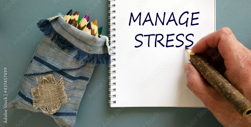 Manage stress symbol. Doctor writing concept words 'manage stress' on ...