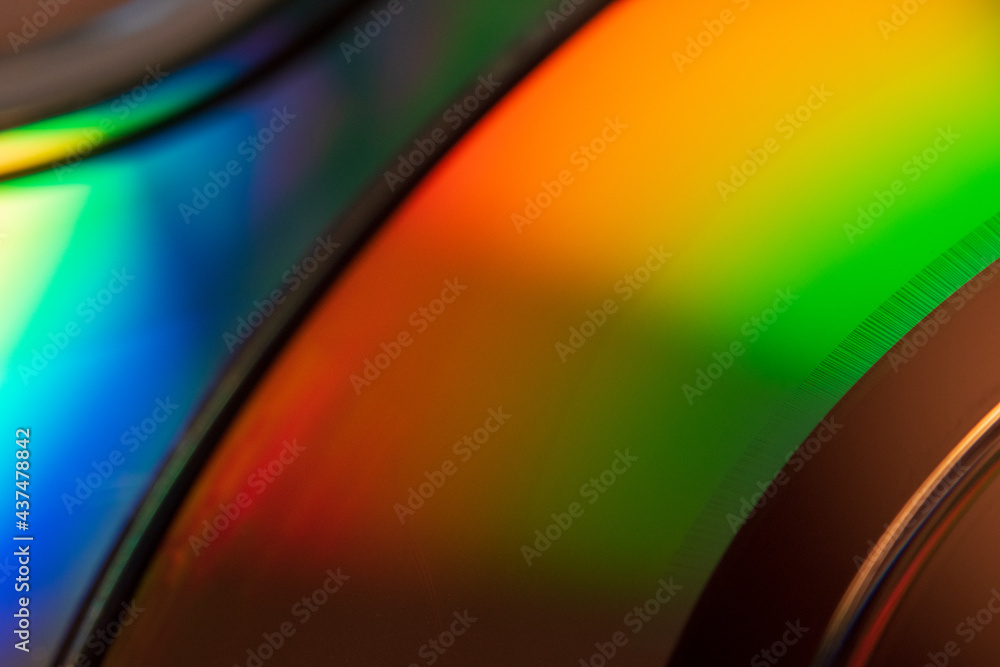 Abstract photo of the reflection of the bottom of a CD displaying a ...