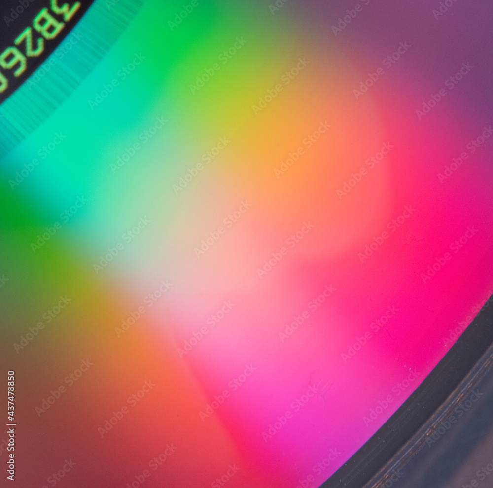 Abstract photo of the reflection of the bottom of a CD displaying a ...