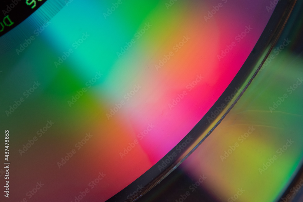 Abstract photo of the reflection of the bottom of a CD displaying a ...