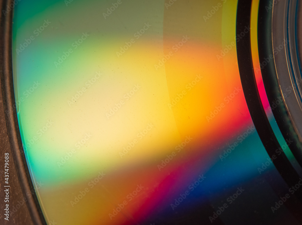 Abstract photo of the reflection of the bottom of a CD displaying a ...
