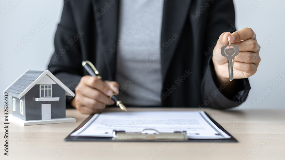 Sales manager or salesperson holds a demo house and has a home purchase ...