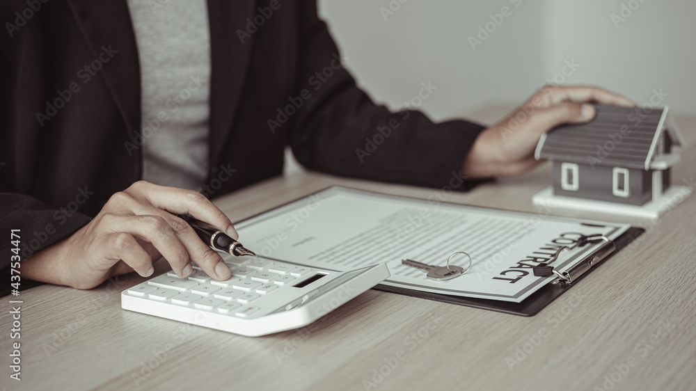 Selling a house with insurance, Salesperson or head of sales holds a ...