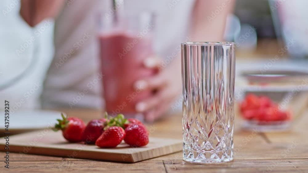 Woman making strawberry milk shake on kitchen table. Stock Video ...