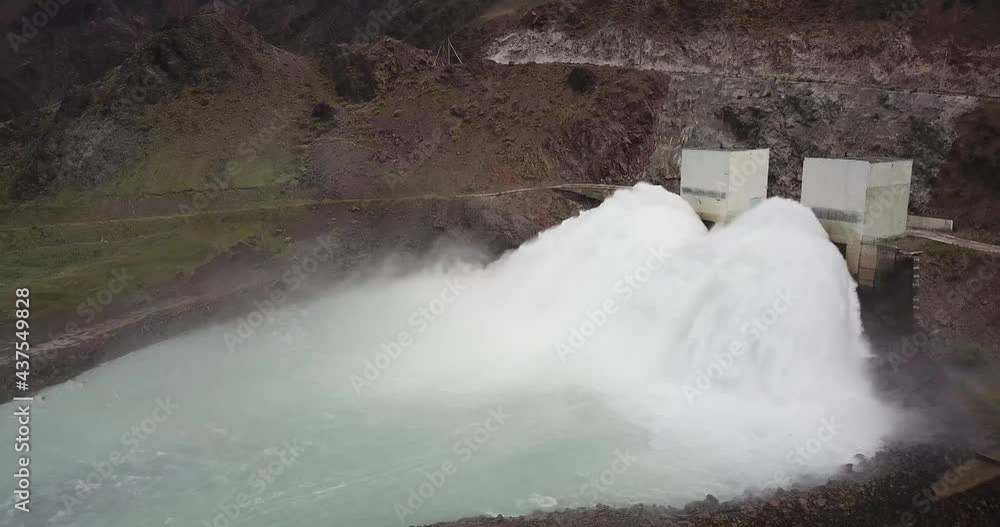 Dam with large discharge pressure of the water. Water dam. Shooting ...
