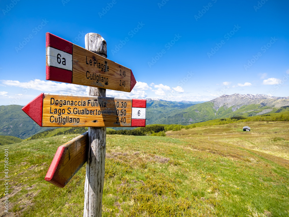 Alpine crossroad with signs indicating to hikers directions and ...