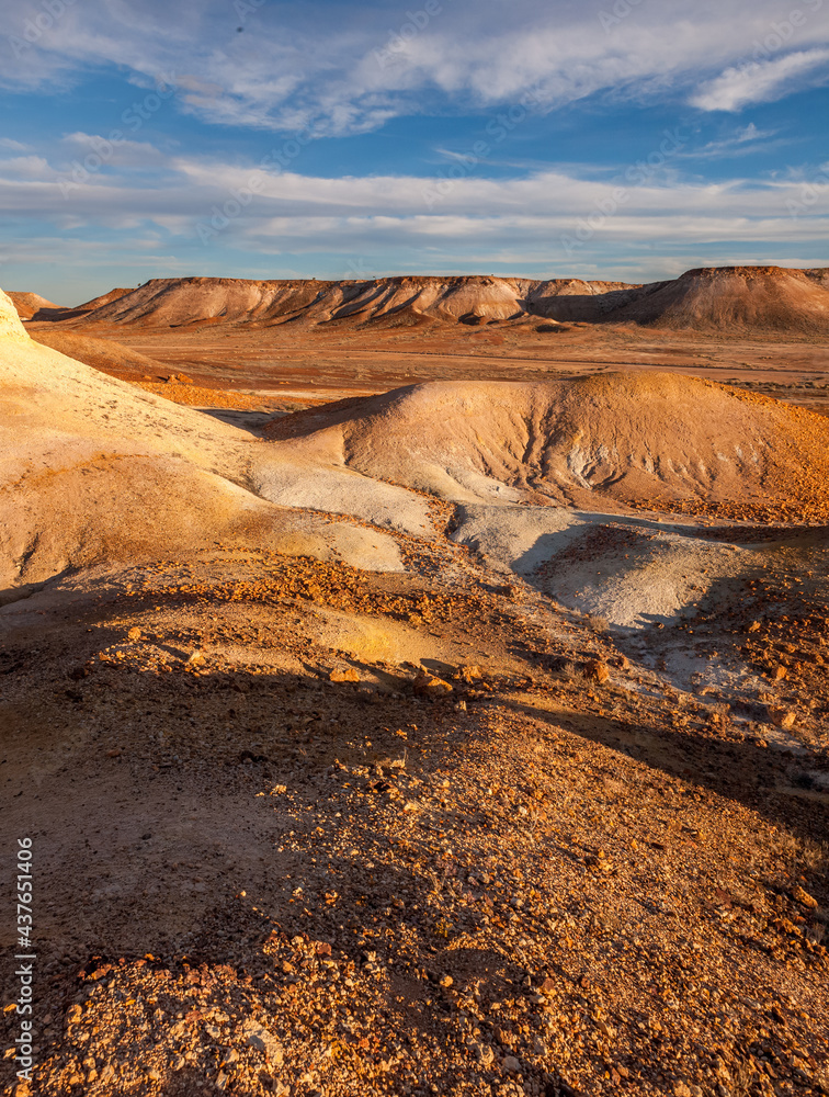 Foto de The eroded land formations at sunset bring out the natural ...