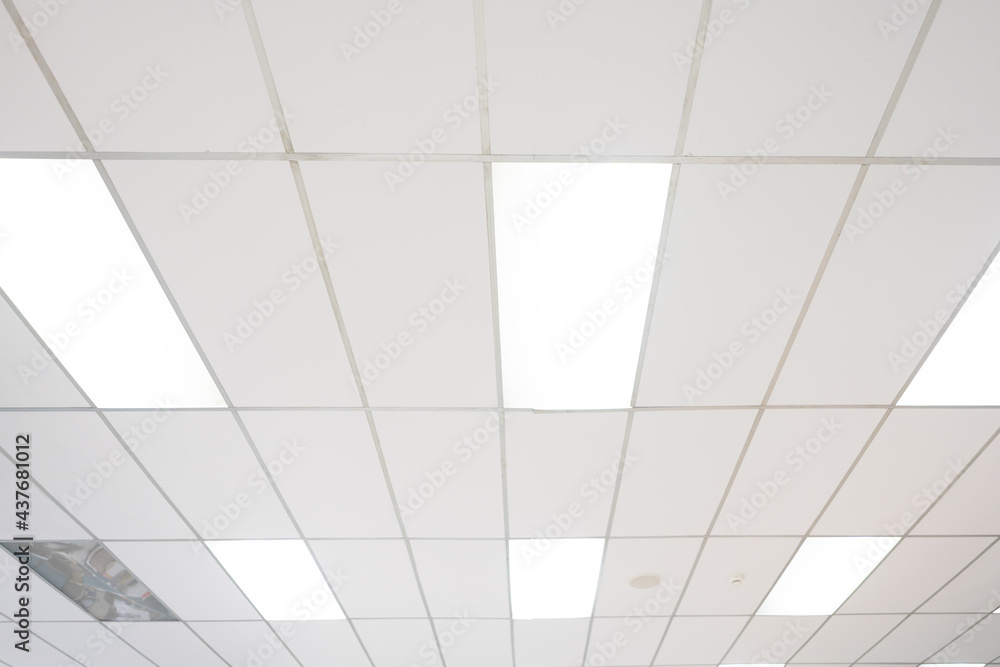 White ceiling with neon light bulbs in uprisen view.as background ...