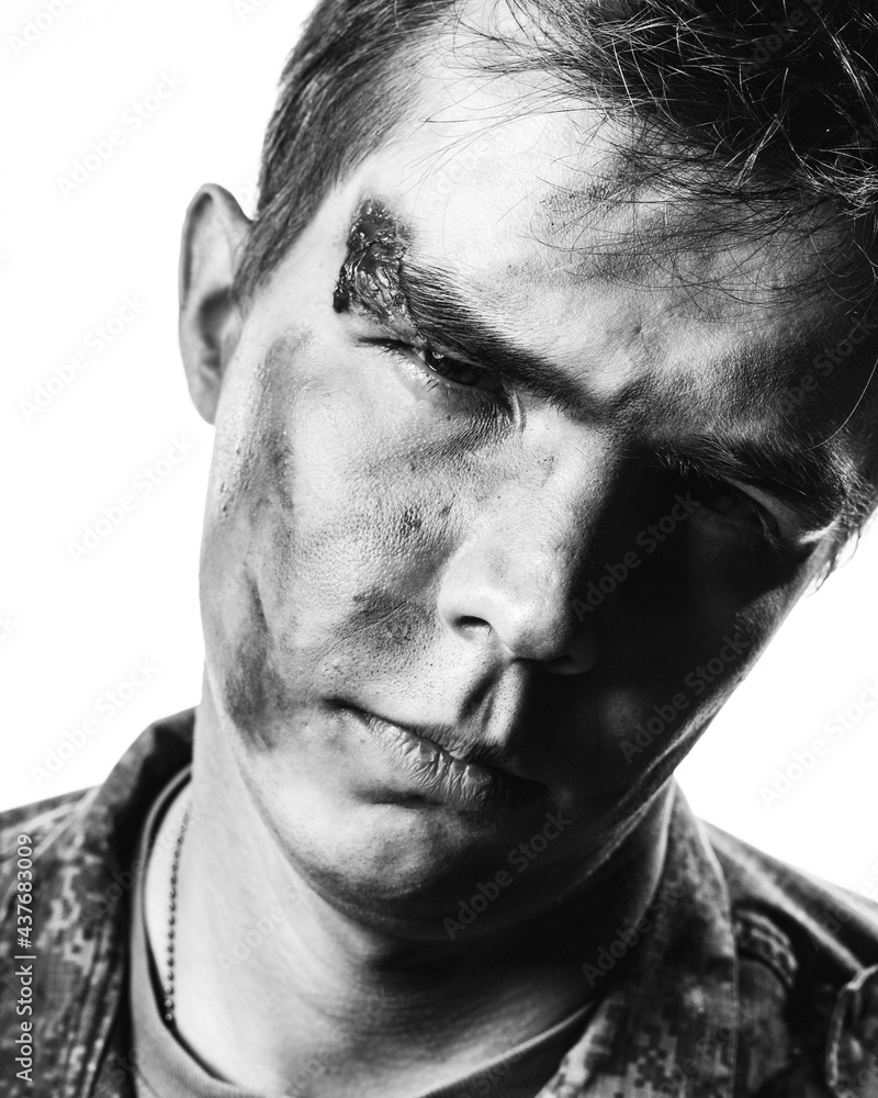Black and white portrait of a young soldier in uniform and combat ...
