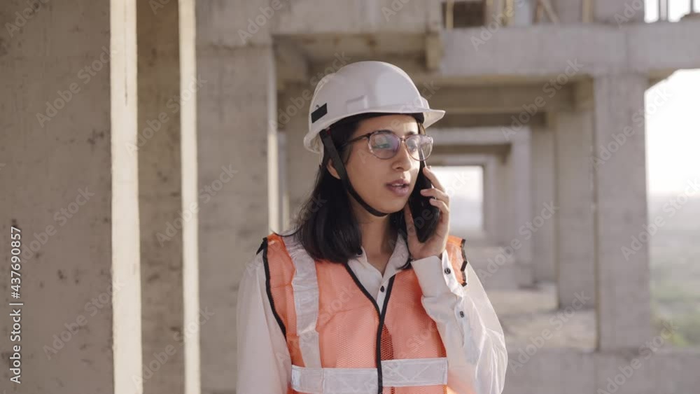 zoom in close up shot of young indian asian woman civil engineer ...