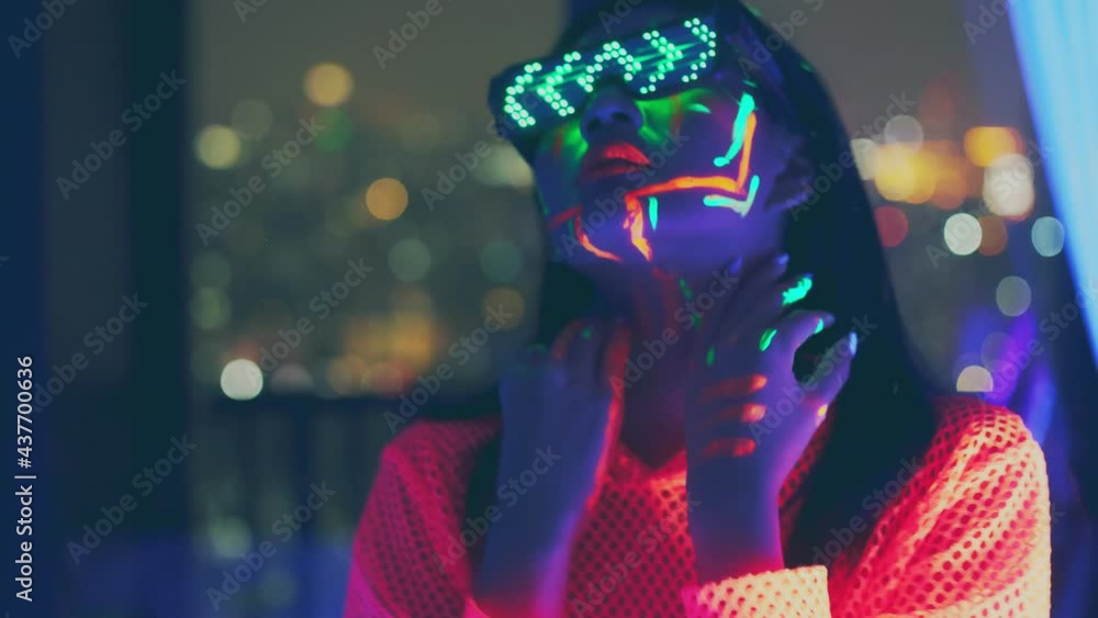 Neon asian woman dancing. Fashion model woman in neon light, portrait ...