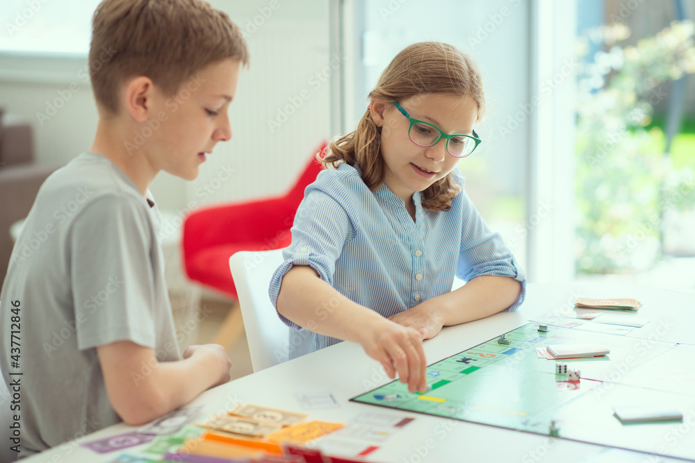 Happy cute children playing board games and having fun at home Stock ...