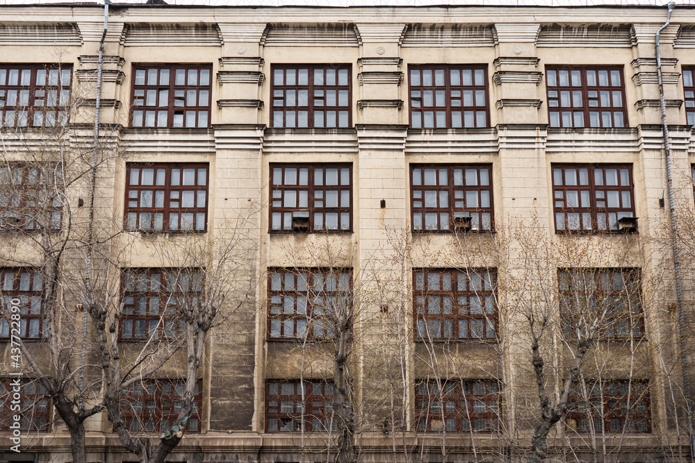 Vintage architecture classical facade old gray building front view. A ...