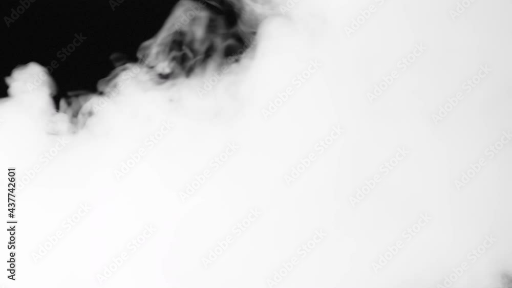 White Smoke Flows in from the Right. Swirling white smoke actively ...