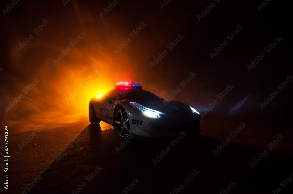 Police car chasing a car at night with fog background. 911 Emergency ...