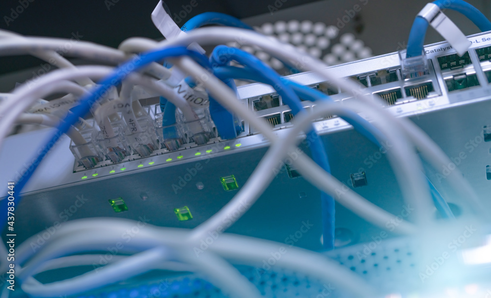 Network switch and ethernet cable in data center. Wifi plug of internet ...