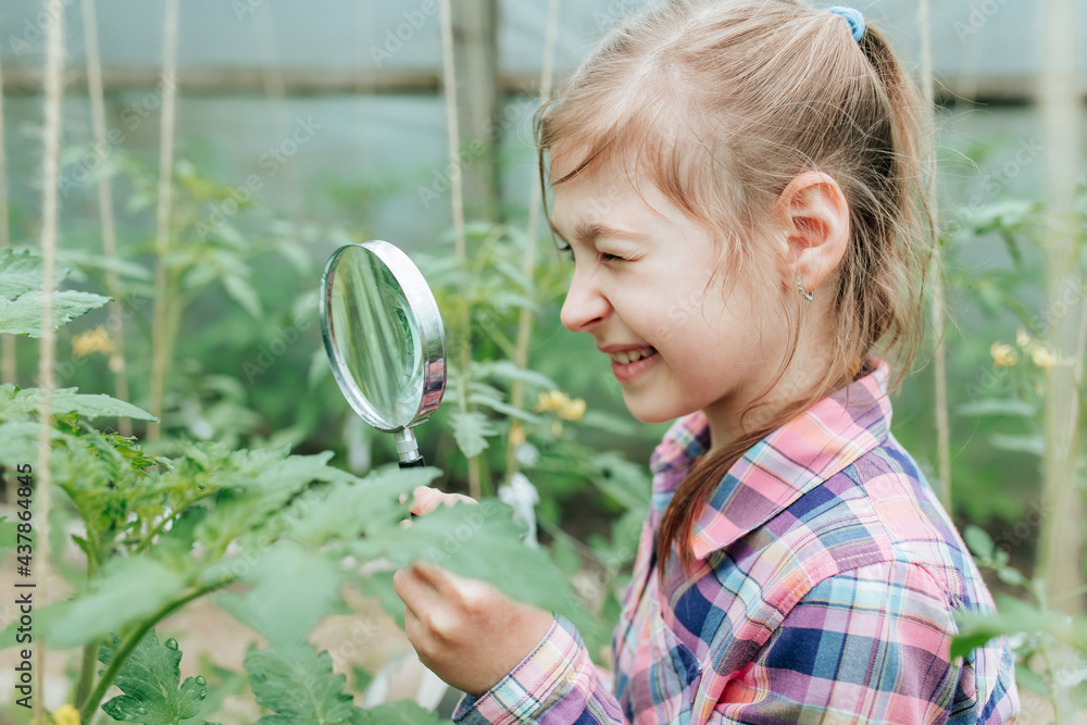 happy Children girl with loupe studying learning nature outside. Child ...