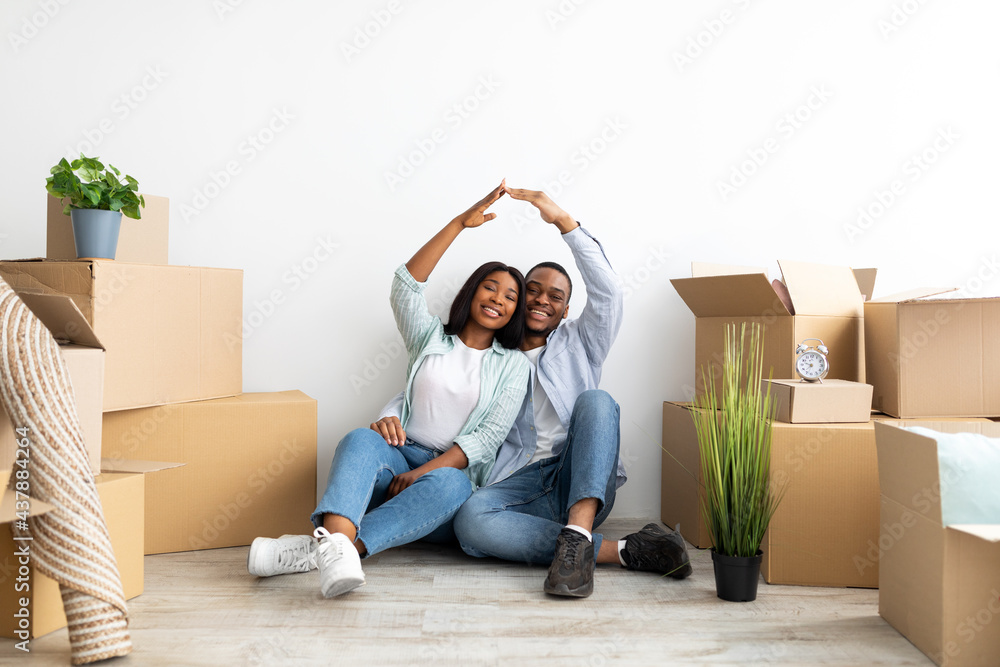 Mortgage for young families. Happy black couple moving to their own ...