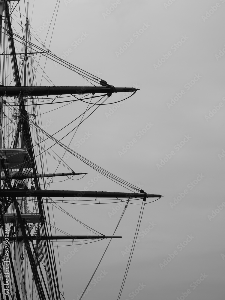 Monochromatic image of a bunch of tall masts. Stock Photo | Adobe Stock