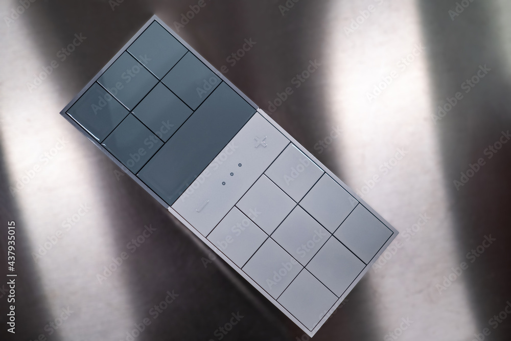 Remote control with square buttons. Stylish modern remote control ...