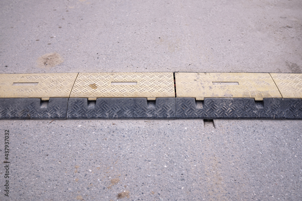 speed bump on an asphalt road, speed breaker, Road bumps in the middle ...