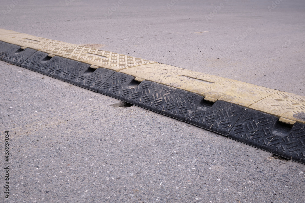 speed bump on an asphalt road, speed breaker, Road bumps in the middle ...