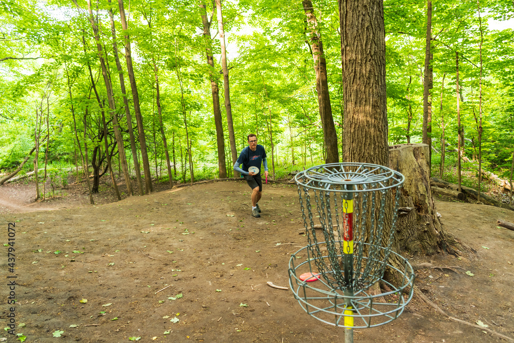 Disc golf is a flying disc sport in which players throw a disc at a ...
