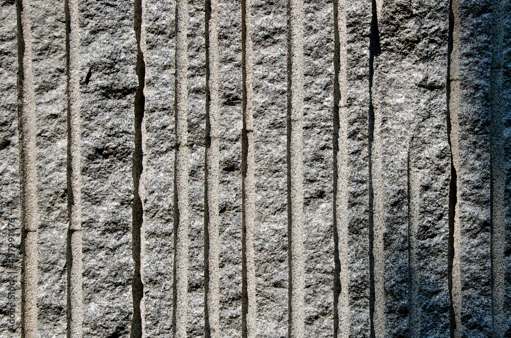 Drill holes add a vertical element to granite wall. The Darwin Center ...