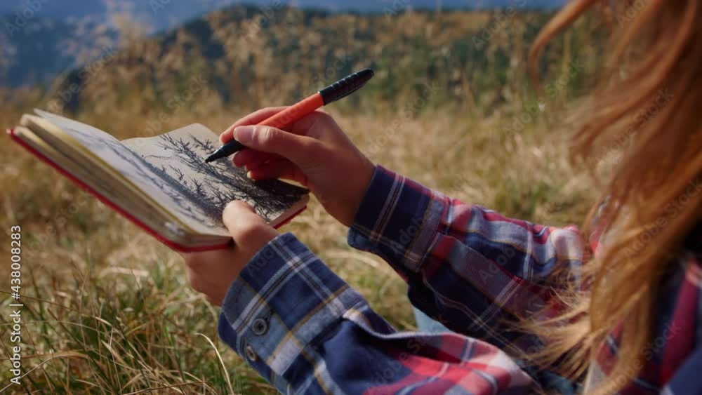 Woman hands drawing picture of trees in notepad. Female arms painting ...