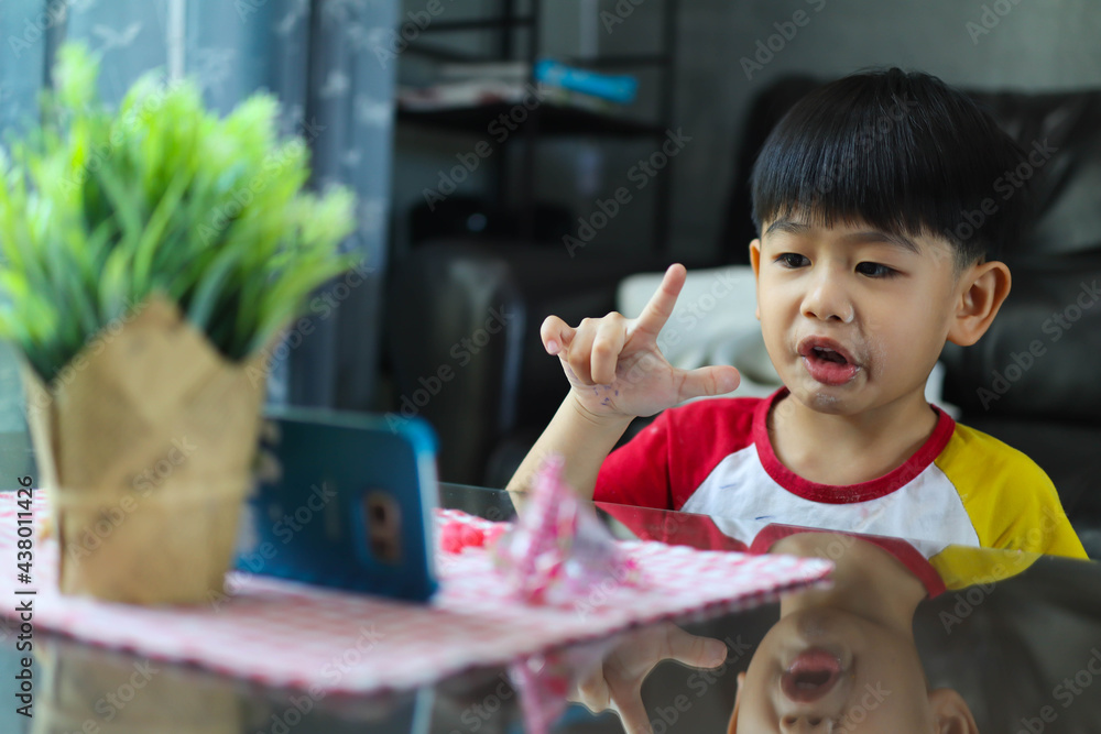 Cute Asian child learning class study online with video call from ...