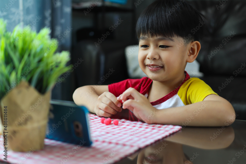 Cute Asian child learning class study online with video call from ...