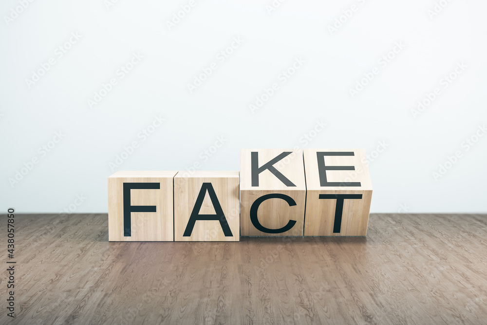 Abstarct wooden blocks with letters forming words Fact and Fake on ...