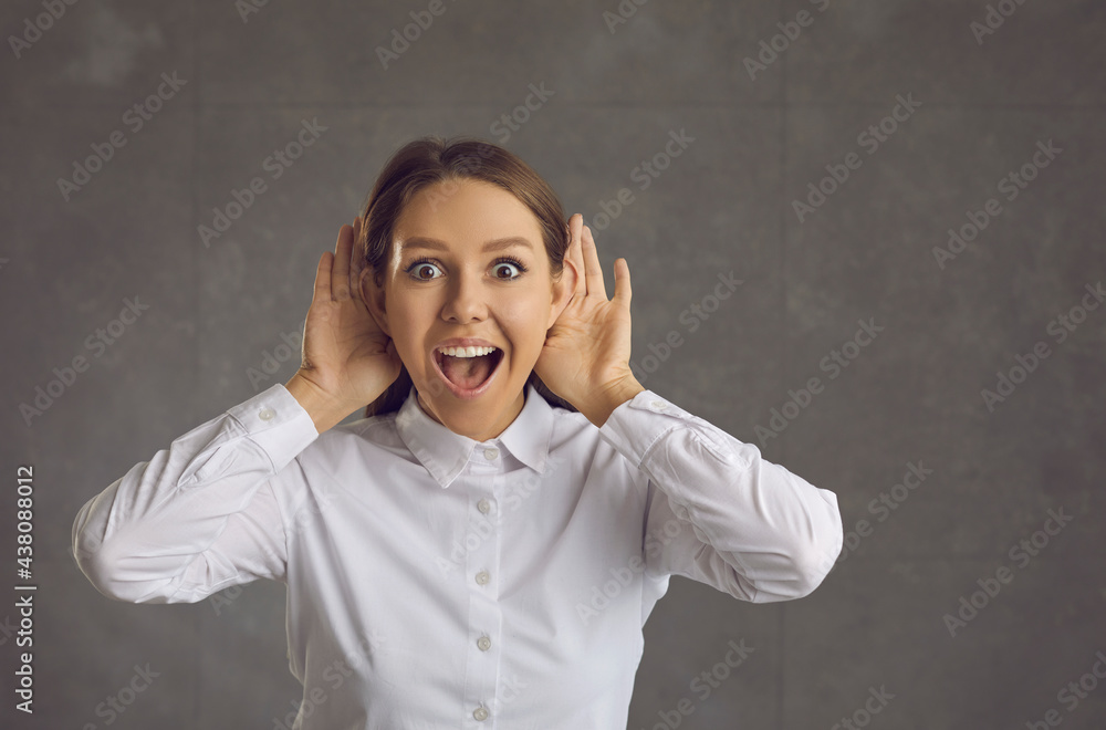 Young business lady learns great amazing news. Happy excited curious ...