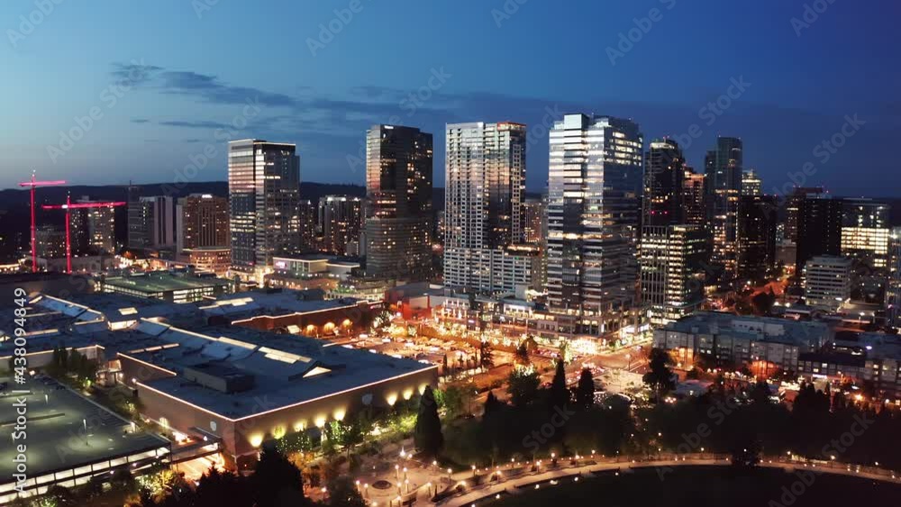 Cinematic 4K aerial drone night rise and reveal shot of the city center ...