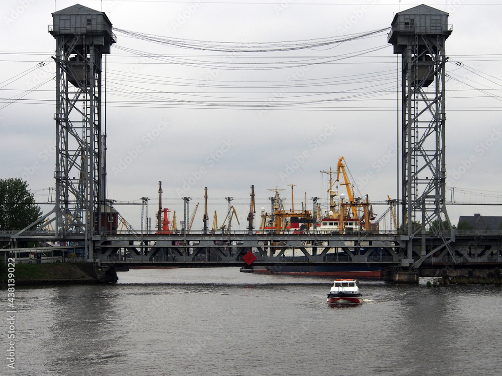 Drawbridge on the background of gantry cranes and ships in the sea ...