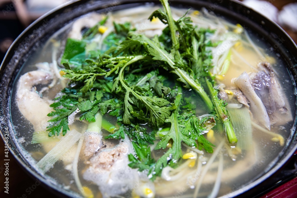 Cod, roe, intestines, vegetables, and bean sprouts boiled in a pot ...
