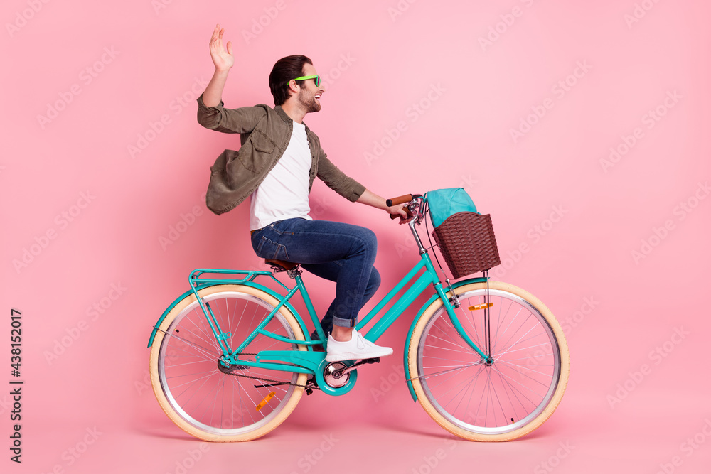 Full length profile side photo of young guy happy positive smile ride ...