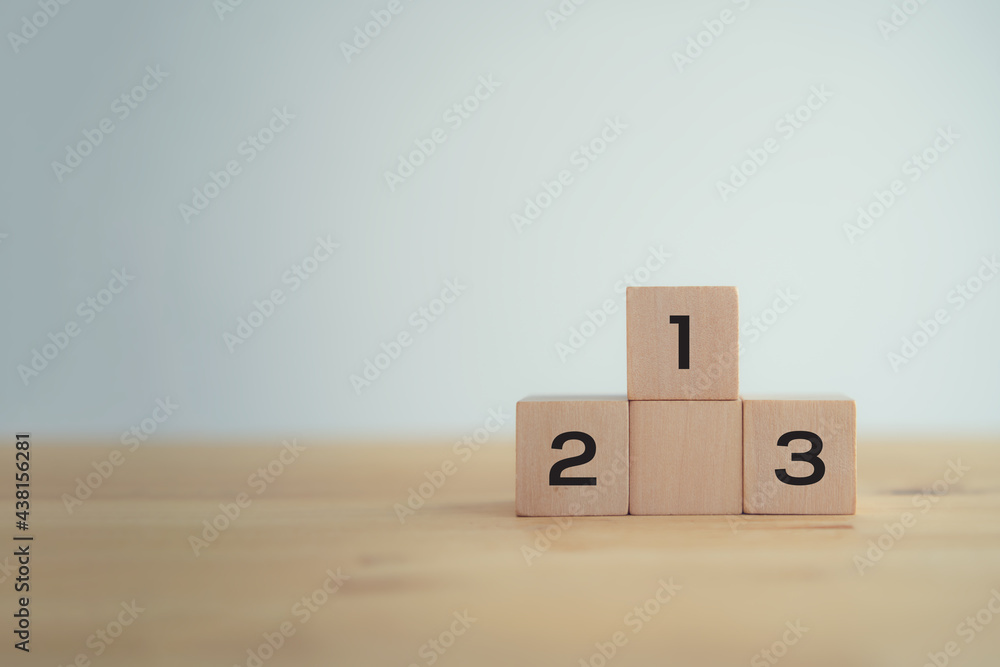 Wooden blocks stacking as a podium on white background. Target of ...