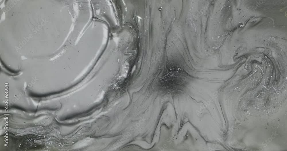 Beautiful metallic gray texture. Wind stream blowing away silver paint ...