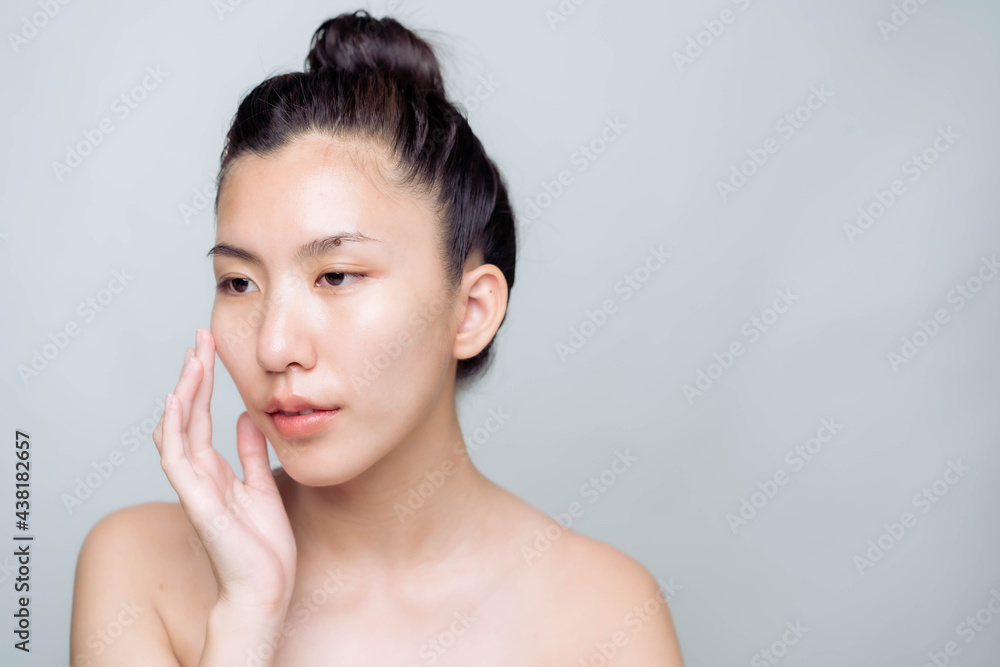 Beautiful young asian woman with clean fresh skin on white background ...